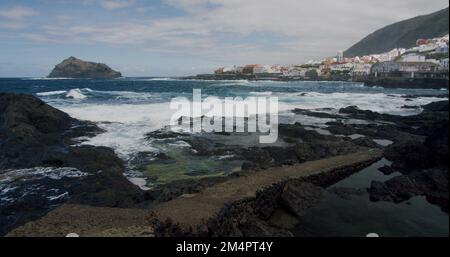 Waterfront of beautiful Garachico town and volcanic shore. Tenerife ...