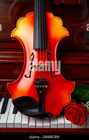 Beautiful Red Rose With Baroque Violin On Piano Keys still life Stock ...