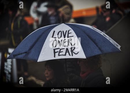 An aerial view of people carrying signs in a freedom protest in ...