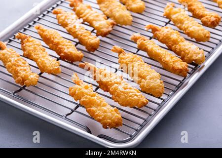 Tempura shrimp just cooked on a cooling rack ready to be served Stock ...