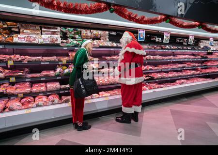 Adelaide, Australia. 23 December 2022. Shoppers dressed as Santa Claus ...
