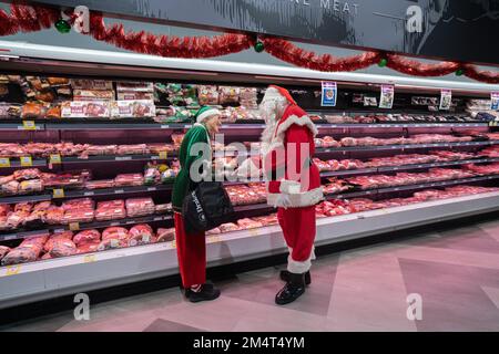 Adelaide, Australia. 23 December 2022. Shoppers dressed as Santa Claus ...