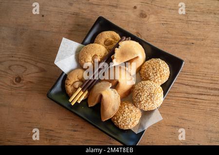 Asian dessert tray in open sunshine with tea Stock Photo - Alamy