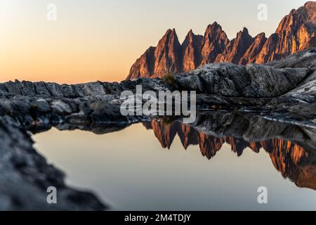 A scenic view of Devils teeth mountains in Senja, Norway, at bright ...