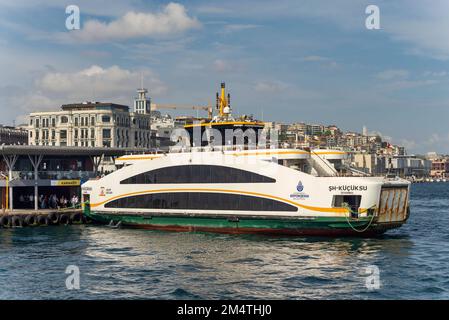 Small ferry boat docked at Karakoy ferry terminal, in a sunny summer ...