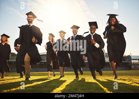 Were finally free. a group of university students running after being ...