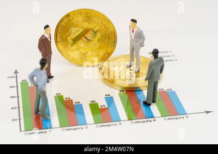 Cryptocurrency and business concept. On the business charts are ...