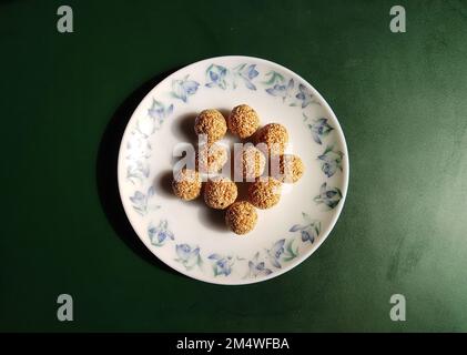 A dish of delicious sesame balls made using sesame seeds and honey. In ...