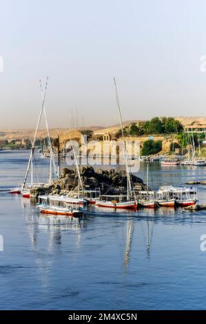 Egypt, Aswan Governorate, Aswan, Boat moored on bank of Nile Stock ...