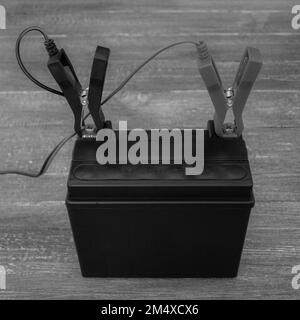 Image of a battery with charger. Reference to charging Stock Photo - Alamy