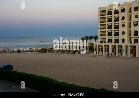 Gorgeous view of the hotel with indoor units and sunset evening sky in ...