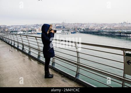 tourist girl photographer with dslr camera outdoor on the bridge in ...