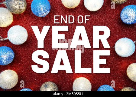 End of Year Sale text with LED cotton balls decoration on purple ...