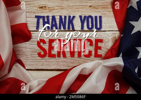 Thank You for Your Service message with American flag on wooden ...
