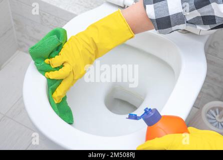 Deep Cleaning service. cleaning wc. Professional cleaner washing toilet ...