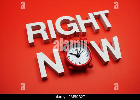 Right Now alphabet letters on purple background Stock Photo - Alamy