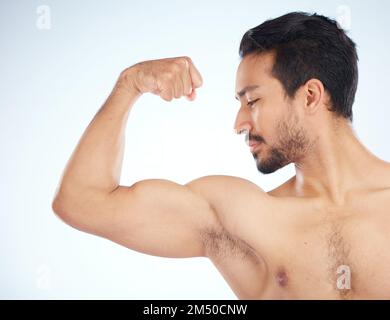 An Asian Fitness Model Flexing His Bicep Muscle Front Facing Stock
