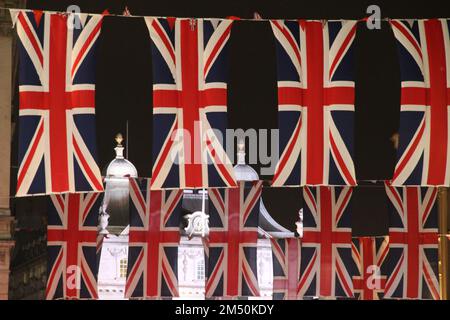 A bunch of Union Jack banners hanging across the streets Stock Photo ...