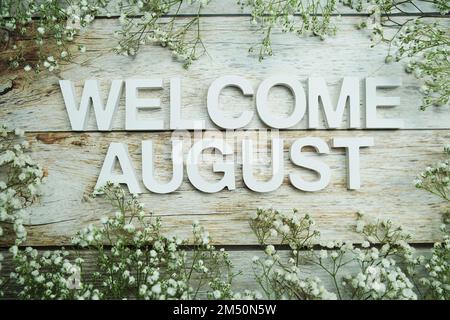 Welcome August alphabet letters with flowers on wooden background Stock ...