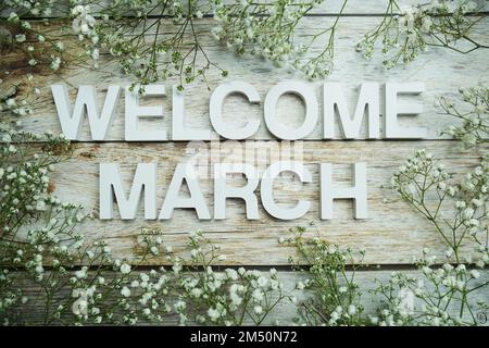Welcome March alphabet letters with flowers on wooden background Stock ...