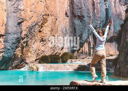Young woman at viewpoint of the natural pools of Millpu, Ayacucho, Peru ...