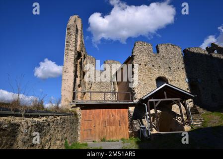 The old Freienfels Castle in Germany surrounded by green trees against ...