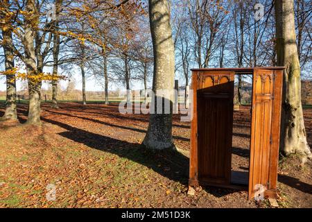 wardrobe amongst trees to represent the entrance to Narnia on a bright ...