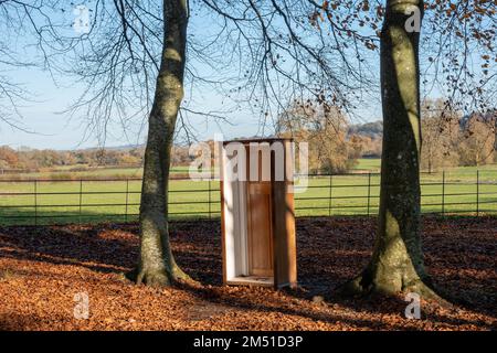 wardrobe amongst trees to represent the entrance to Narnia on a bright ...