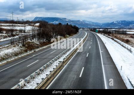 Silent freeway road in snowy winter season. Asphalt highway background ...