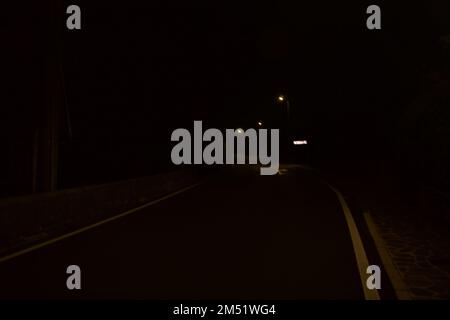 Country road with street lamps at night Stock Photo - Alamy