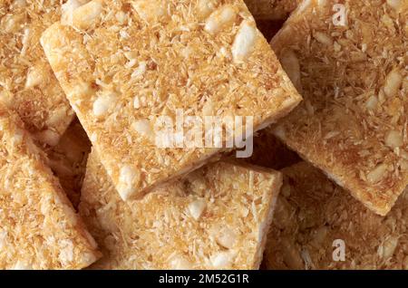coconut biscuits, textured crispy square shaped homemade cookies on a ...