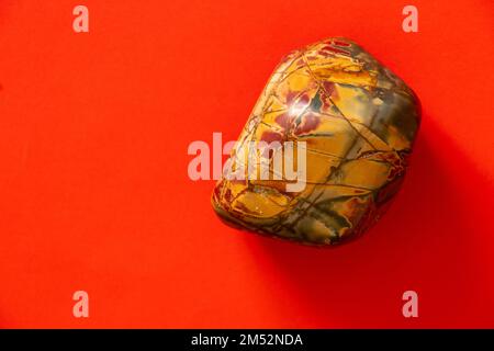jasper stone on a colored background Stock Photo - Alamy