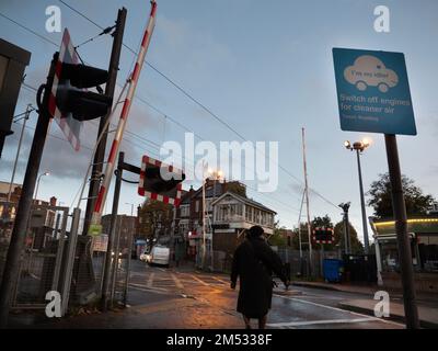 Switch off engines for cleaner air sign, at railway crossing in Highams ...