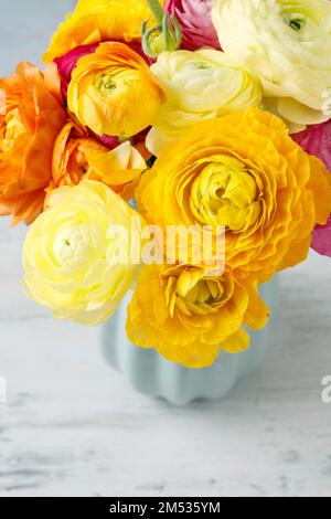 Bouquet of colorful ranunculus flowers. Party decor Stock Photo - Alamy
