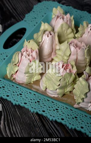 Zephyr tulips. Natural homemade marshmallow. Arranged on a tray. Close ...