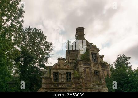 Old abandoned chateau in france surrounded by trees Stock Photo - Alamy