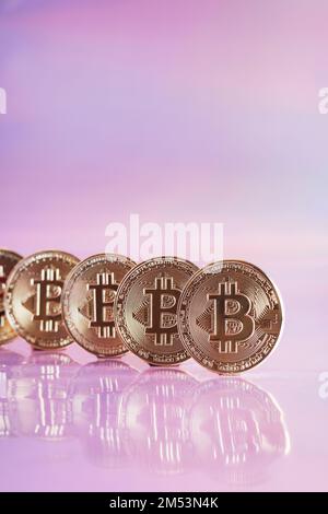 Golden bitcoin coins on holographic, abstract, neon background. digital ...