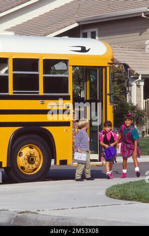 Children getting off school bus Stock Photo - Alamy