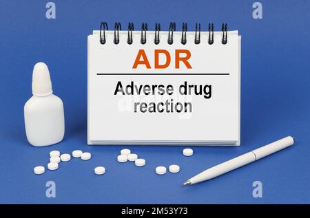 Concept of ADR - Adverse Drug Reaction write on paperwork with ...