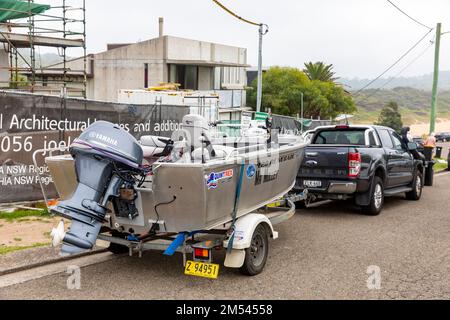 Australian made Quintrex tinnier dinghy boat parked on a trailer in a ...