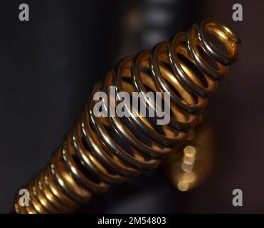 A close up of a coil metal handle on a woodstove door Stock Photo - Alamy