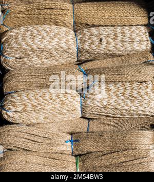 Bundle of linen rope in a market place Stock Photo - Alamy