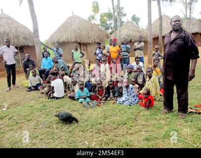 Lusaka, Uganda. 01st Dec, 2022. Musa Hasahya (right) on his farm with ...