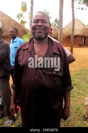 Lusaka, Uganda. 01st Dec, 2022. Musa Hasahya (right) on his farm with ...