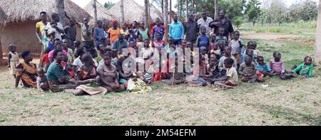 Lusaka, Uganda. 01st Dec, 2022. Musa Hasahya (right) on his farm with ...