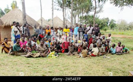 Lusaka, Uganda. 01st Dec, 2022. Musa Hasahya (right) on his farm with ...