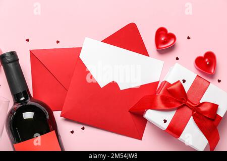 Envelopes with gift and candles on pink background. Valentine's Day ...