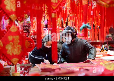 NANTONG, CHINA - DECEMBER 26, 2022 - People shop for New Year ornaments ...