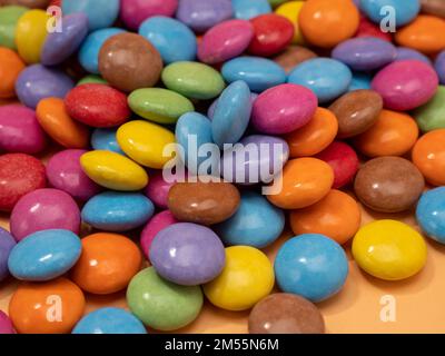 Small multi-colored round candies. Sweets covered with sugar icing ...