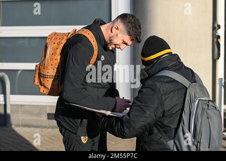 Tobias Figueiredo #6 of Hull City signs an autograph for a young fan ...